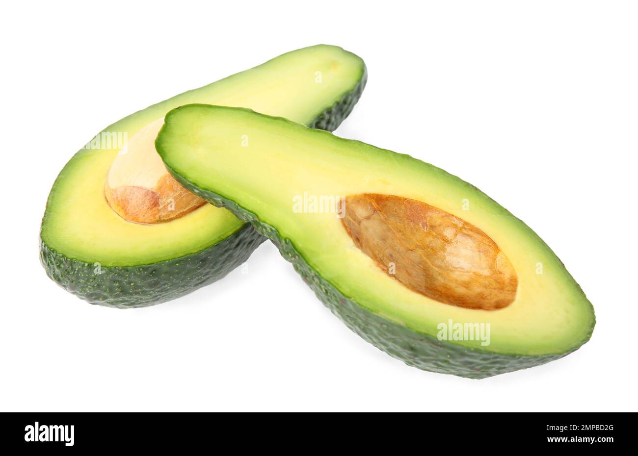 Cut tasty ripe avocados on white background. Tropical fruit Stock Photo ...