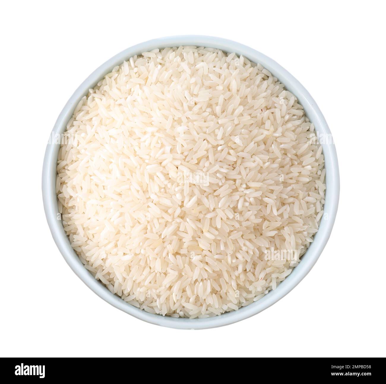 Uncooked rice in bowl isolated on white, top view Stock Photo - Alamy