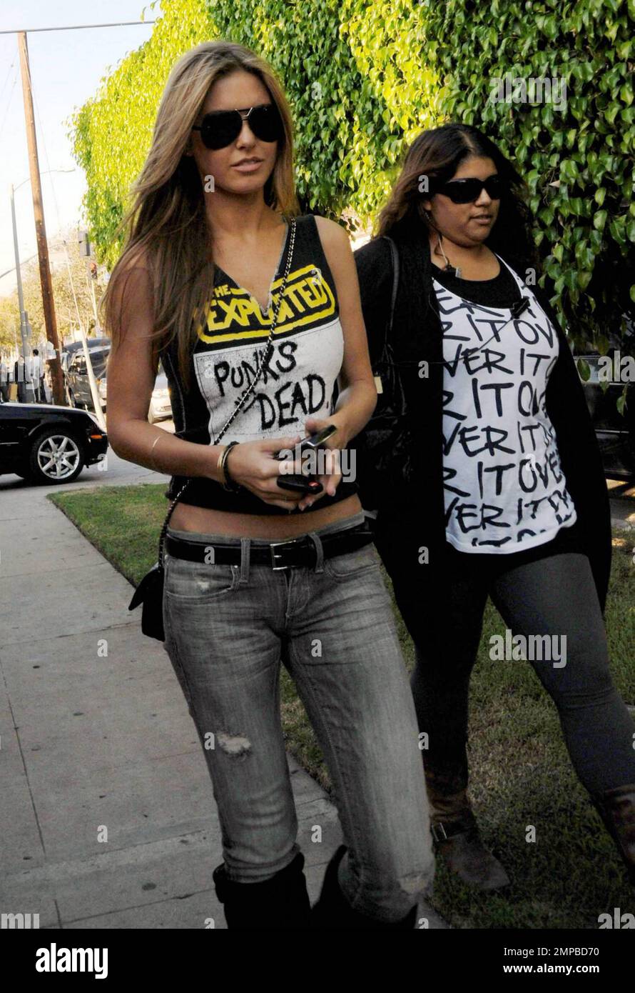 Audrina Patridge goes punk, wearing a sleeveless shirt that reads ...
