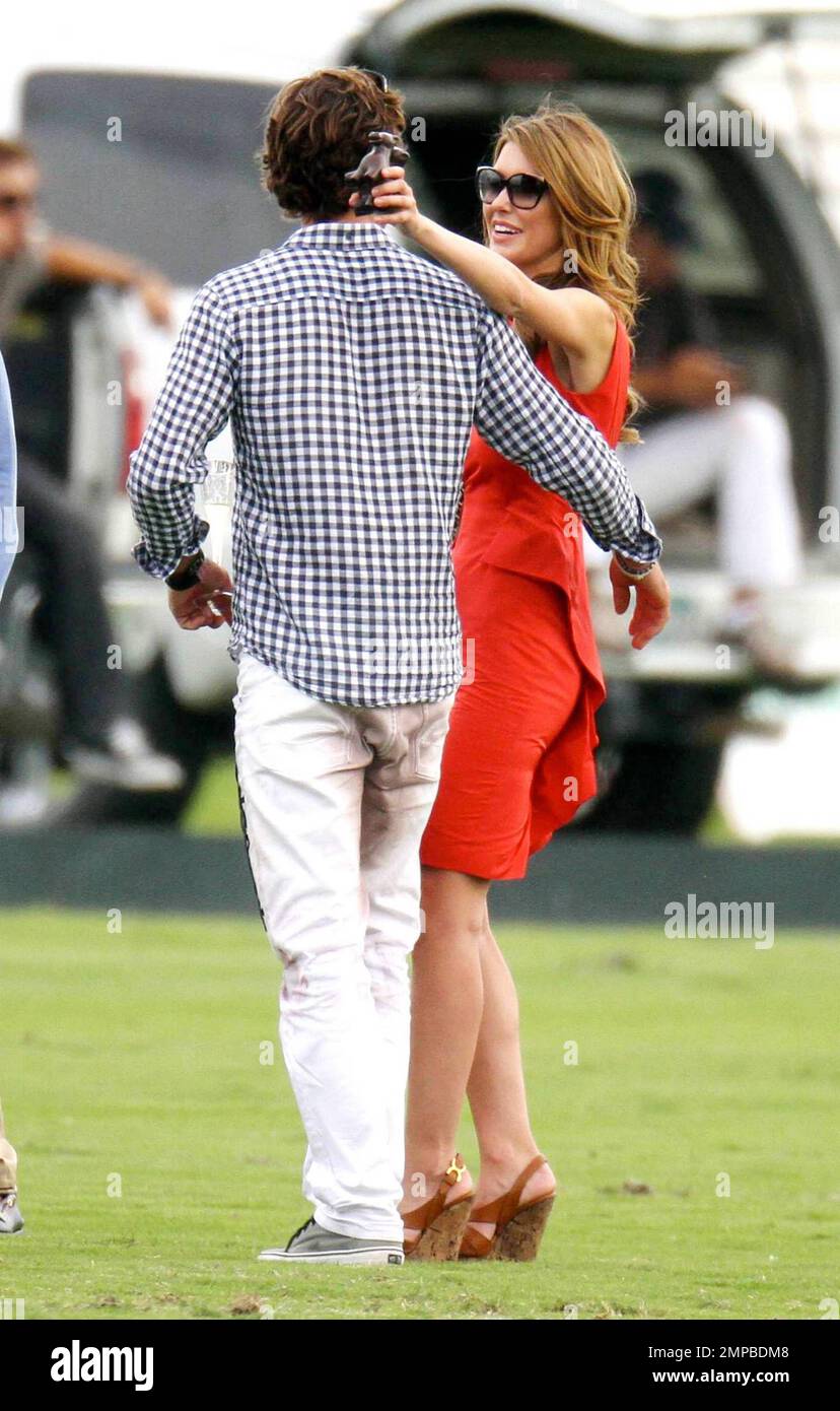 Looking very elegant in a red dress American television personality ...
