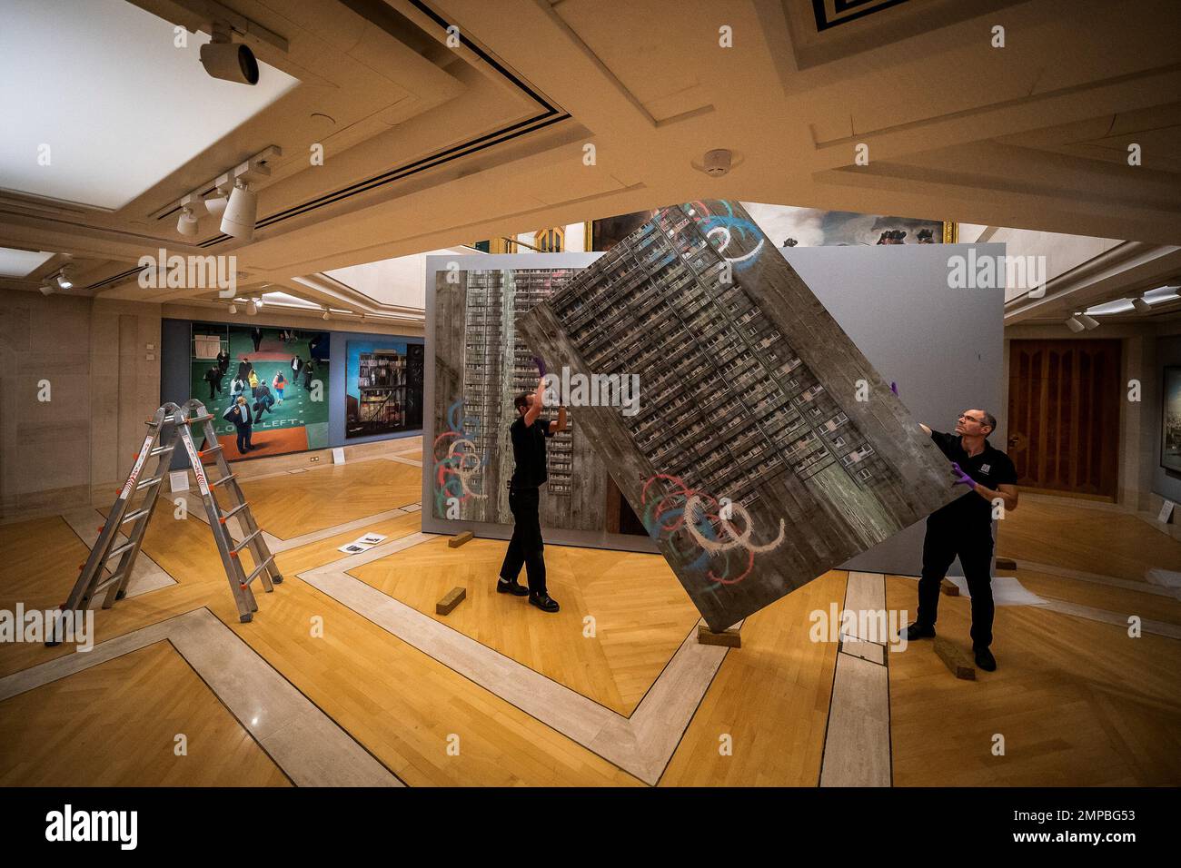 Workers prepare to install Gordon House West Face (triptych displayed ...