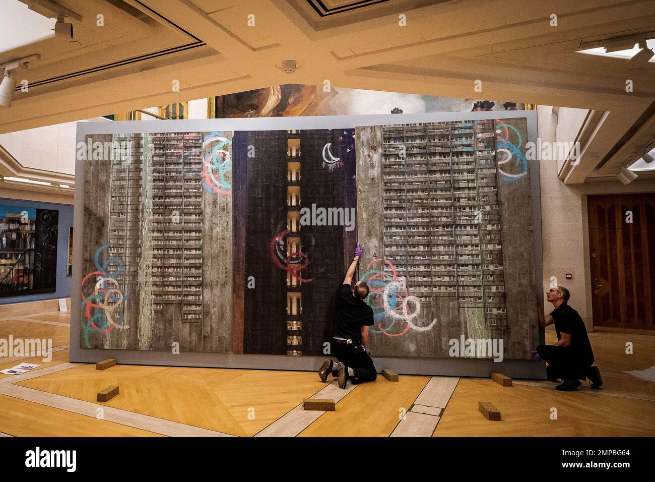 Workers prepare to install Gordon House West Face (triptych displayed ...