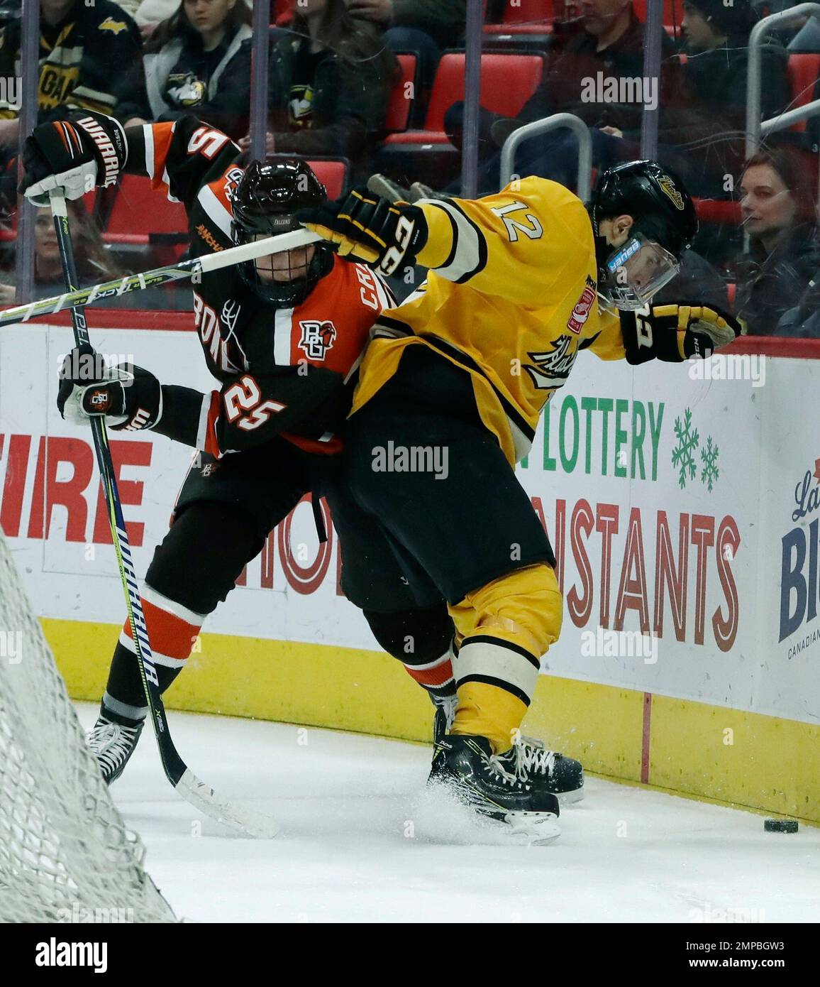 Bowling Green forward Sam Craggs (25) and Michigan Tech defenseman Mark ...