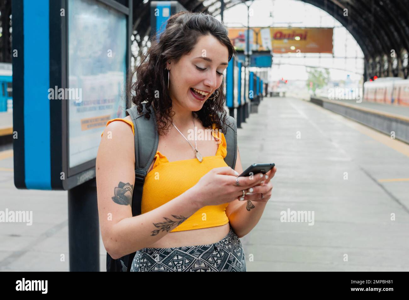 young latin woman of argentinian ethnicity dressed in yellow, she is ...
