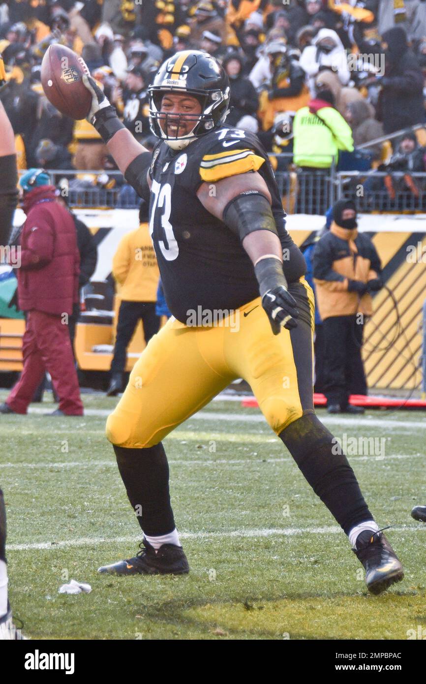 Pittsburgh Steelers offensive guard Ramon Foster (73) spikes the ball ...