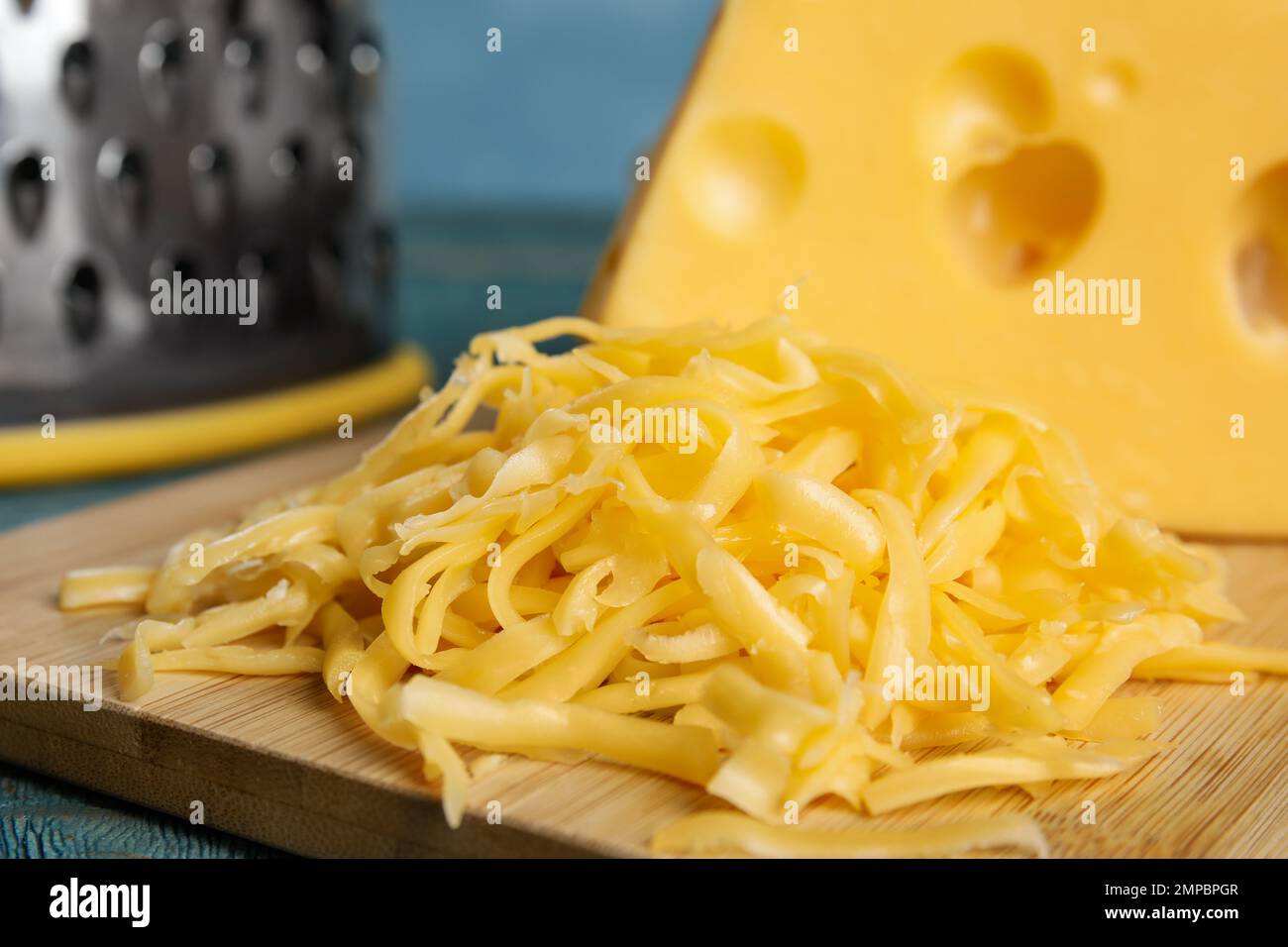 Pile grated cheddar cheese cheddar cheese block hi-res stock ...