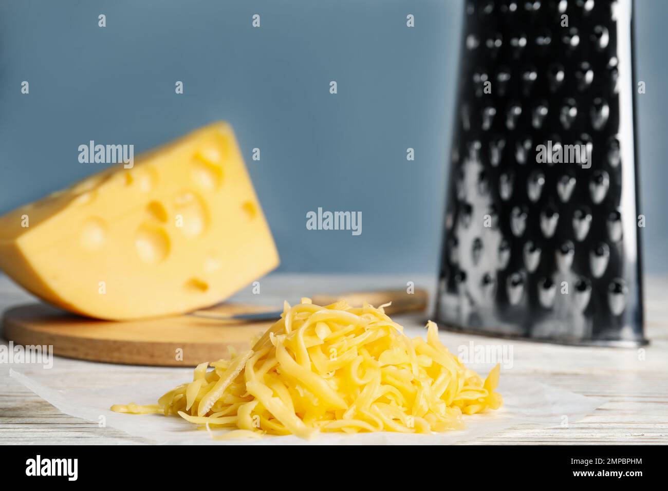 Block cheddar cheese grated pile hi-res stock photography and images ...