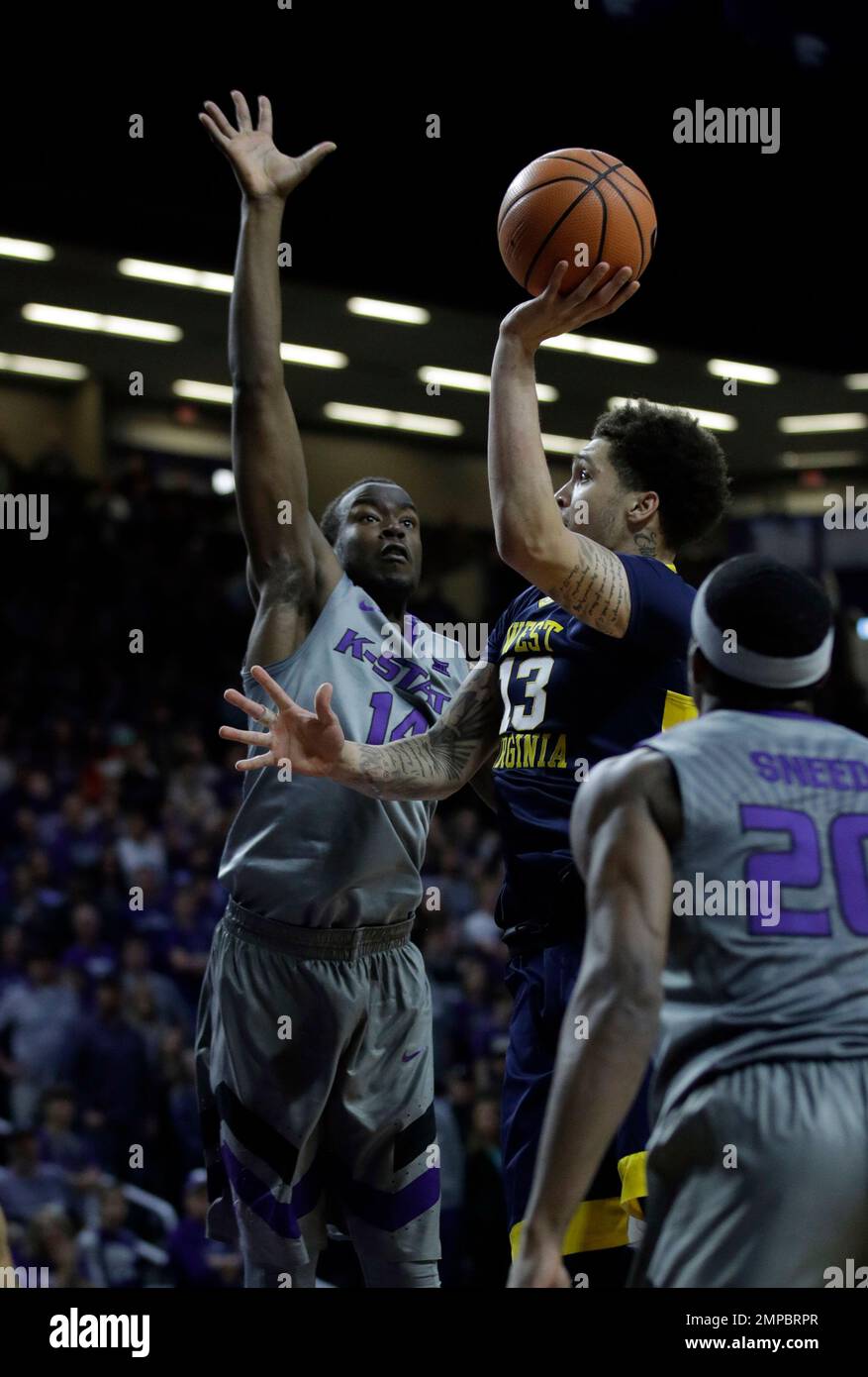 Kansas State forward Makol Mawien (14) and West Virginia forward Teddy ...