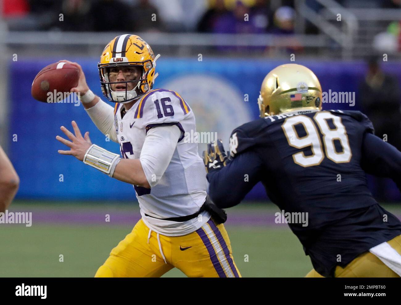 LSU quarterback Danny Etling (16) looks for a receiver as he is ...