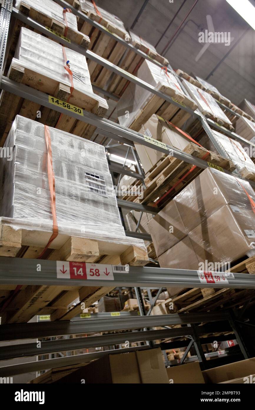 Modern warehouse shelves with pile of cardboard boxes Stock Photo - Alamy