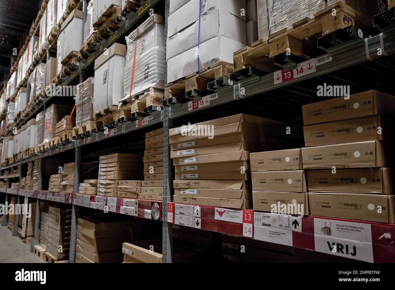 Warehouse shelves loaded up with boxes Stock Photo - Alamy
