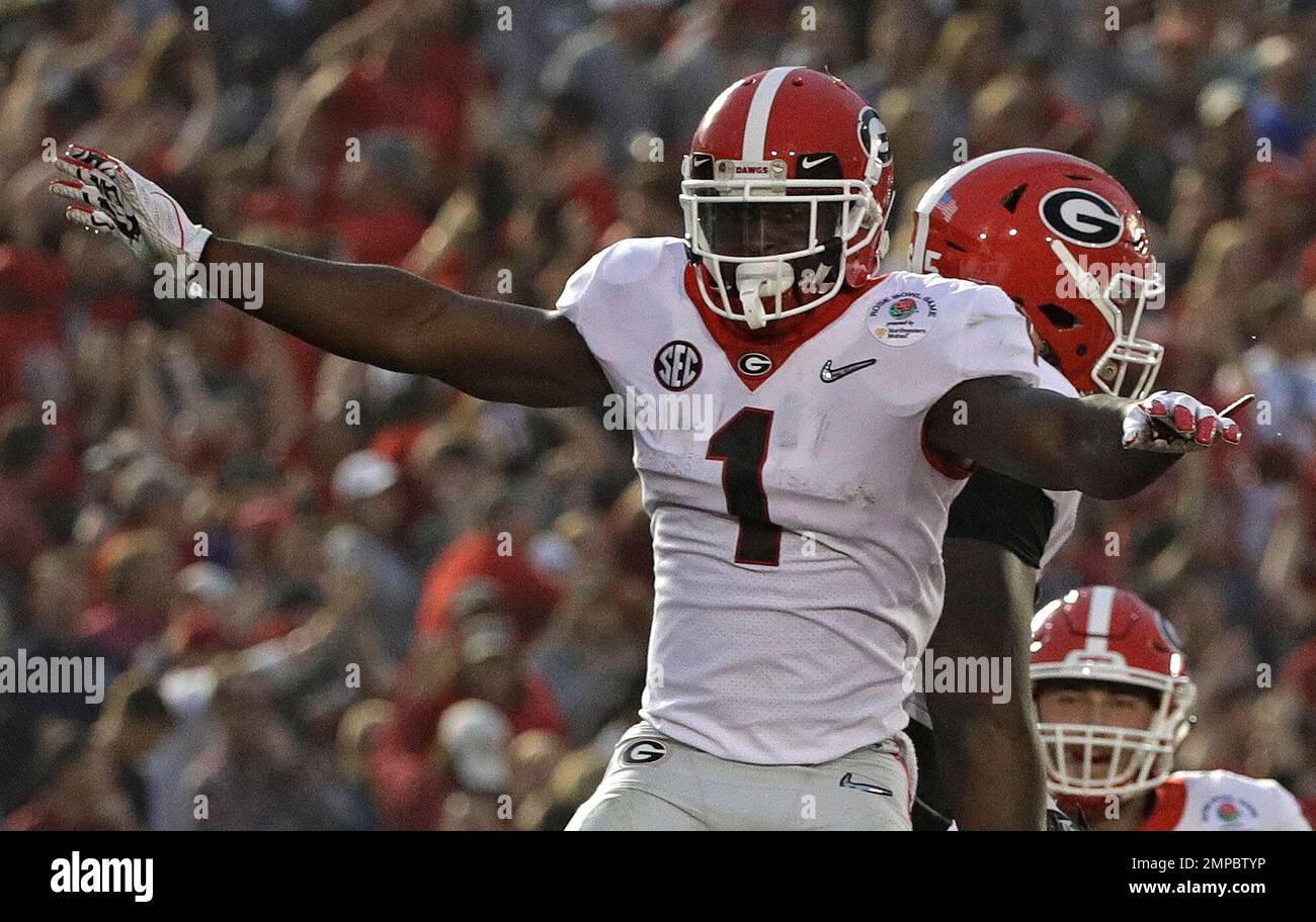 Georgia running back Sony Michel (1) celebrates with offensive tackle ...