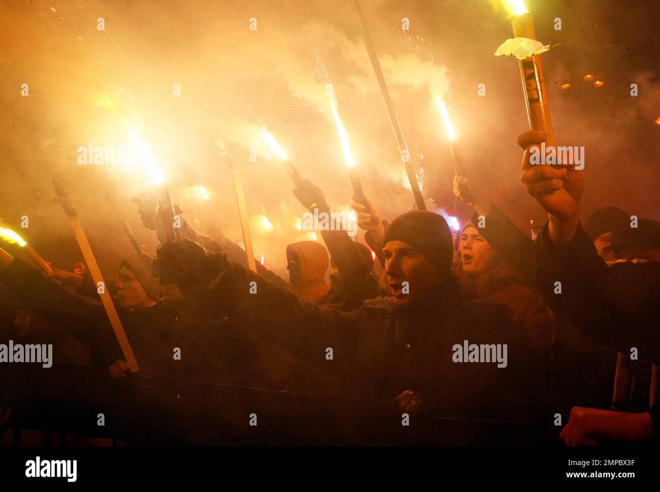 Activists of various nationalist parties carry torches and flares ...