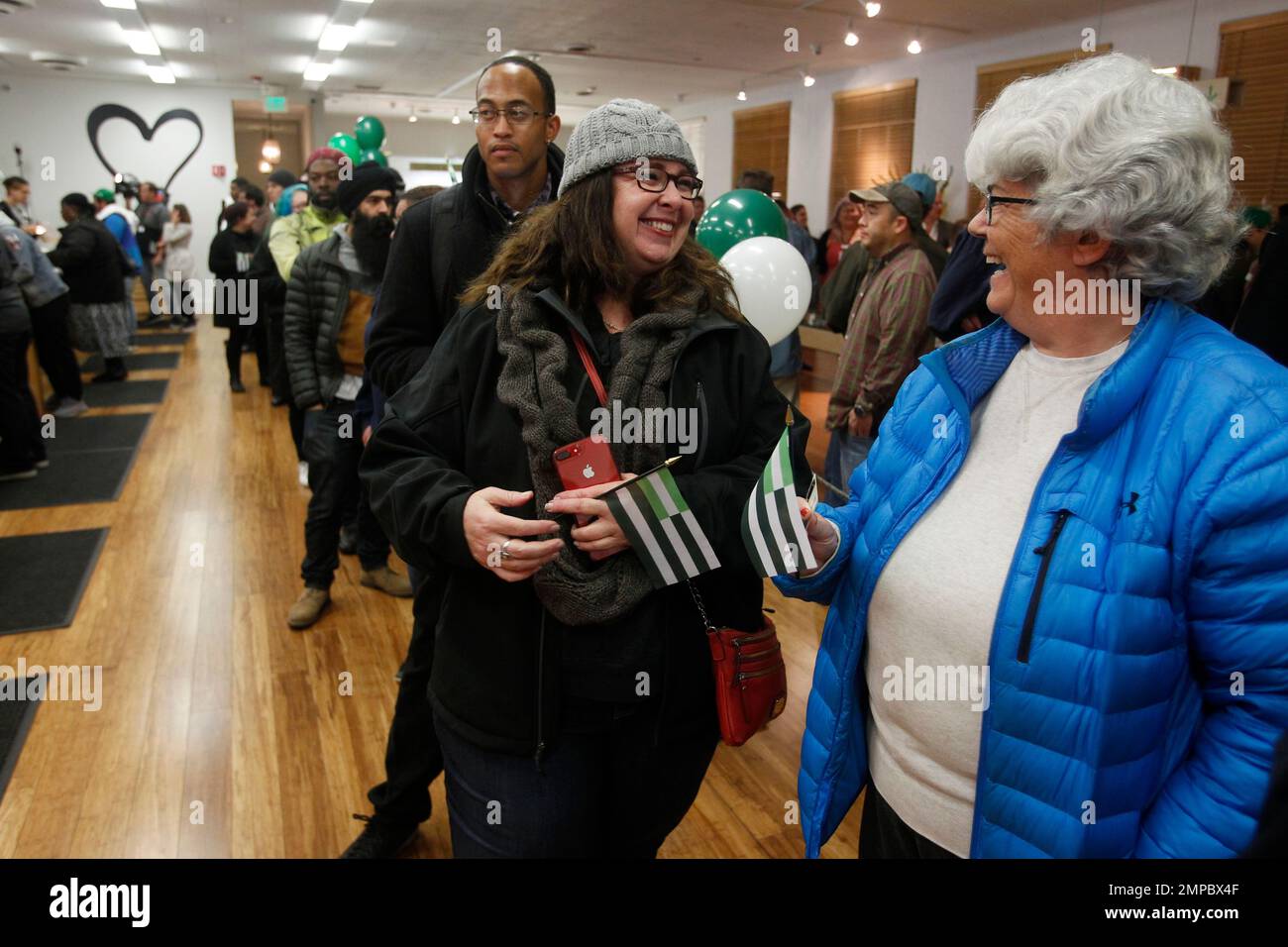Margot Simpson, right, and Diana Gladden wait in line to purchase ...