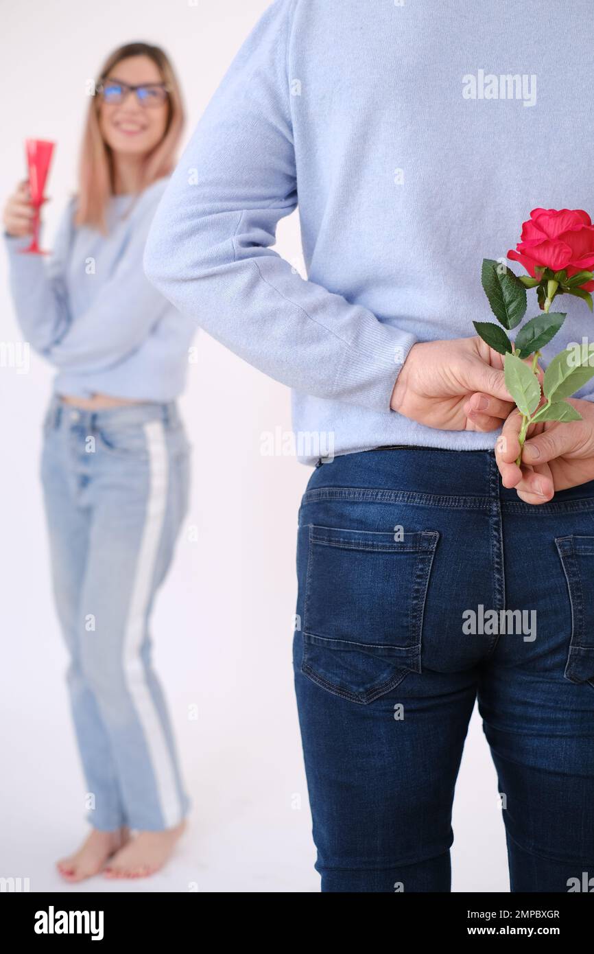 Man hiding rose behind back hi-res stock photography and images - Alamy