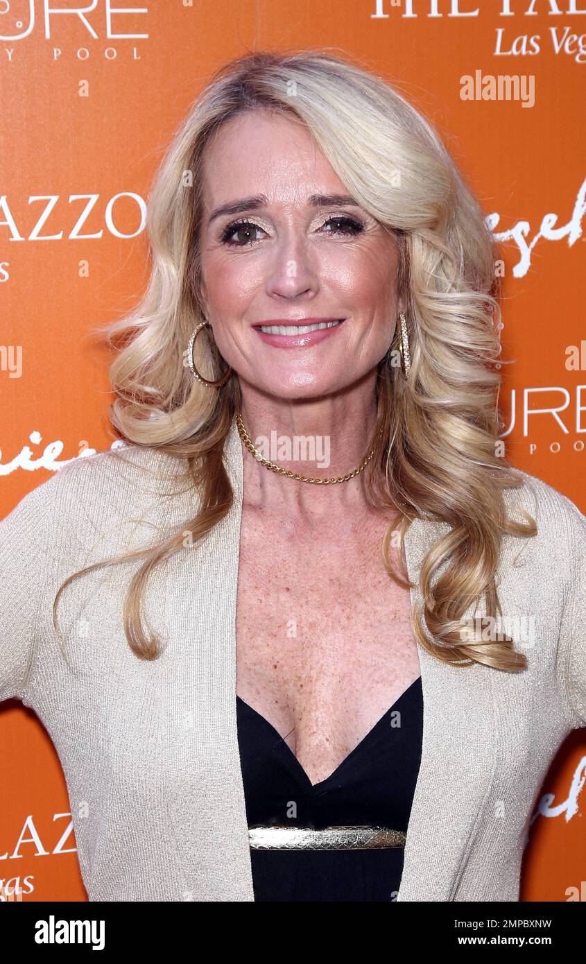 Kim Richards poses for photographers at the Grand Opening of Azure ...