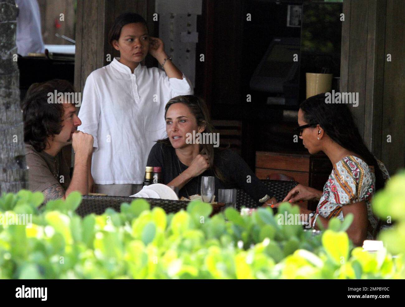 Barbara Feltus and Arne Quinze enjoy an ocean-front lunch at a luxury ...
