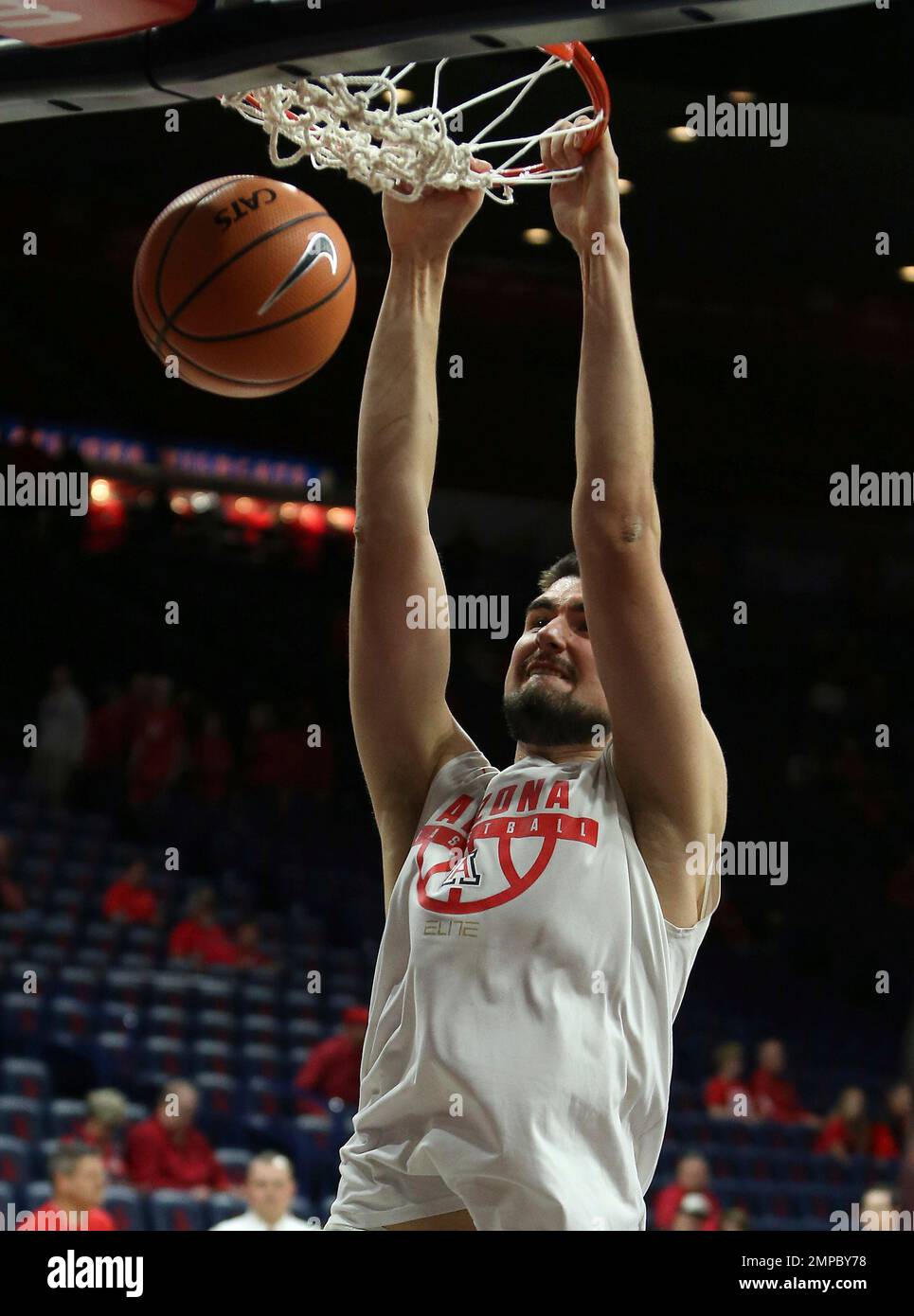 Arizona center Dusan Ristic dunks the ball prior to an NCAA college ...