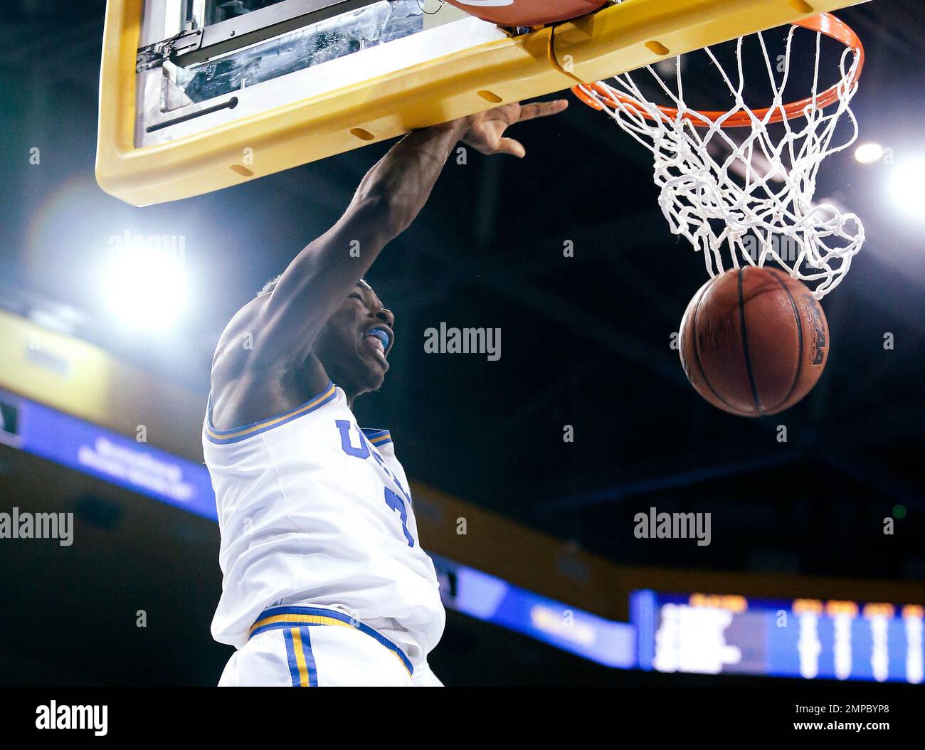 UCLA guard Aaron Holiday dunks against Washington during the second ...