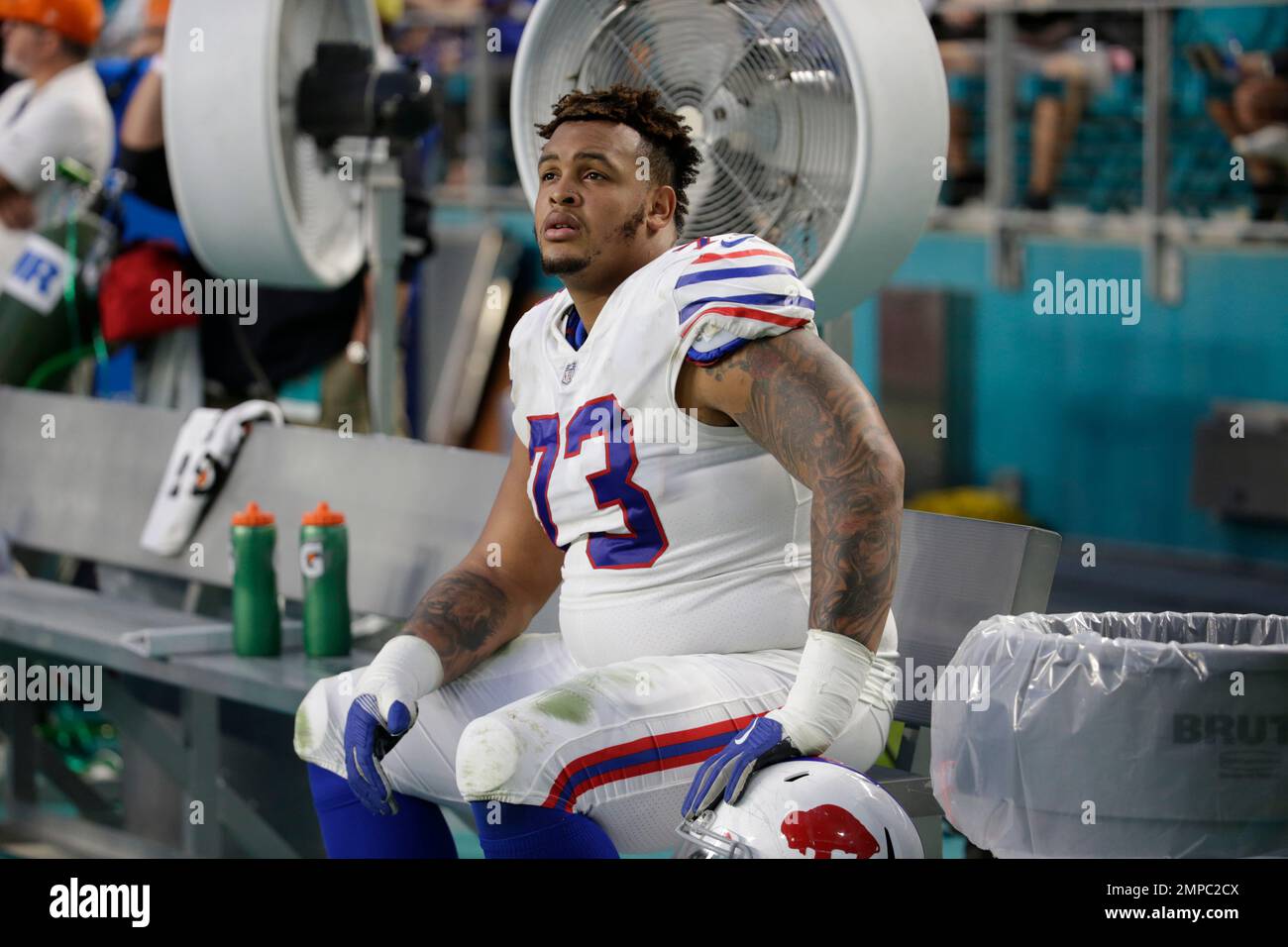 Buffalo Bills offensive tackle Dion Dawkins (73) sits on the sidelines ...