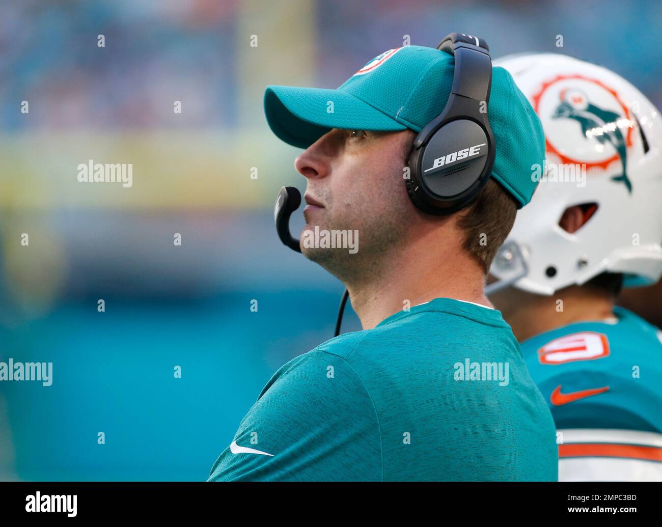 Miami Dolphins head coach Adam Gase looks up during the first half of ...