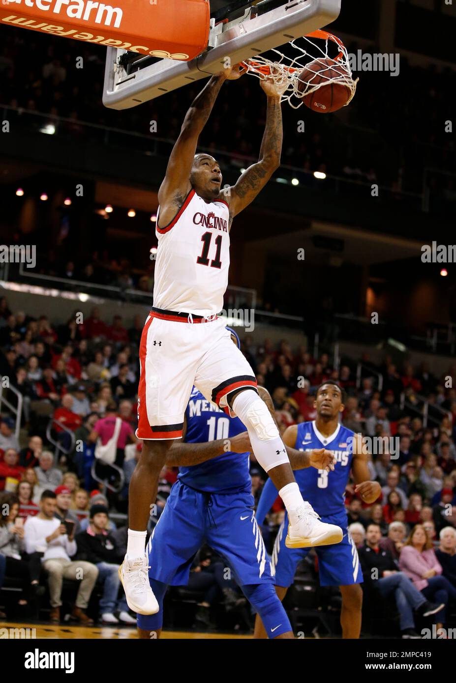 Cincinnati forward Gary Clark (11) dunks in front of Memphis forward ...
