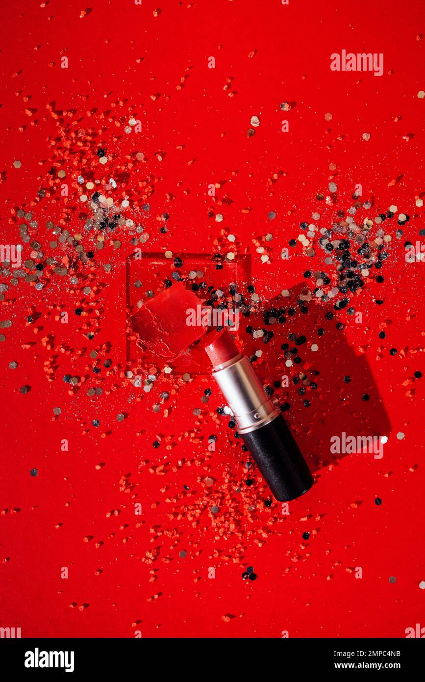Cosmetics smear of smudged red lipstick on transperent glass. Bright ...