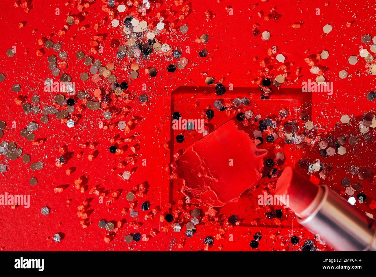 Cosmetics smear of smudged red lipstick on transperent glass. Bright ...