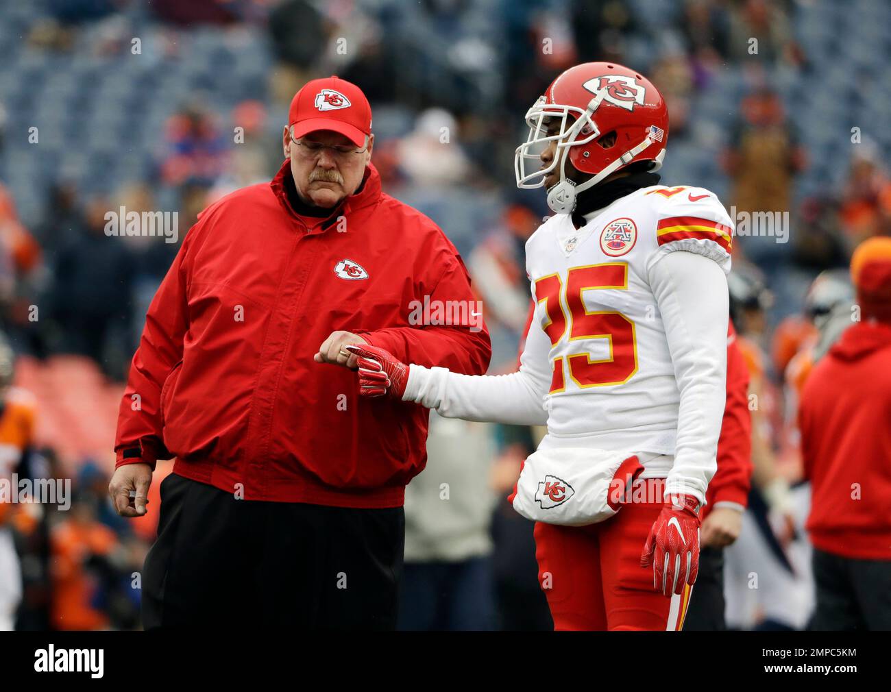 Kansas City Chiefs head coach Andy Reid, left, bumps fists with ...