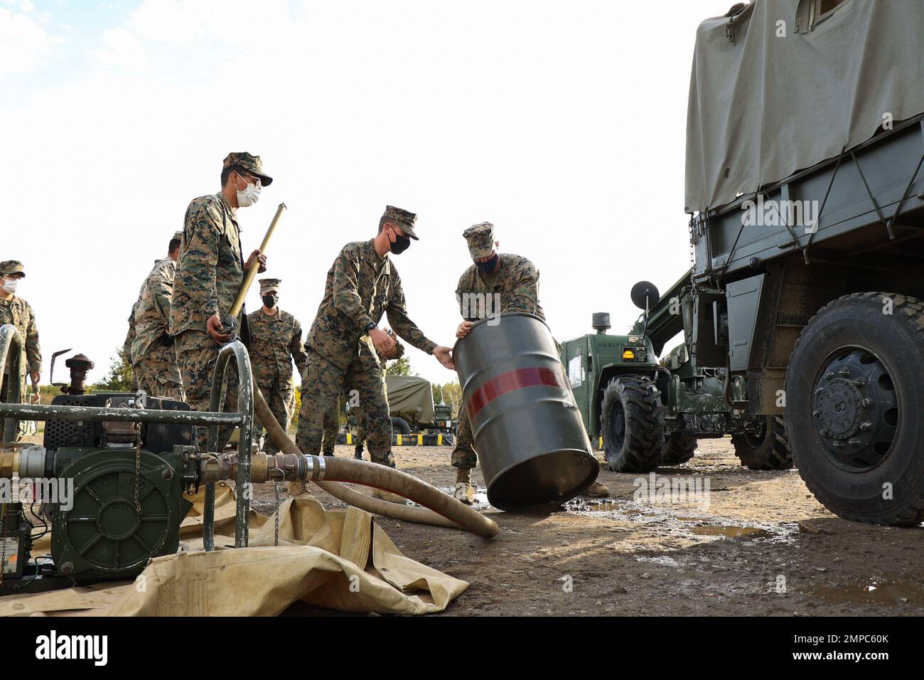 U.S. Marines with 12th Marine Regiment, 3d Marine Division, conduct a ...