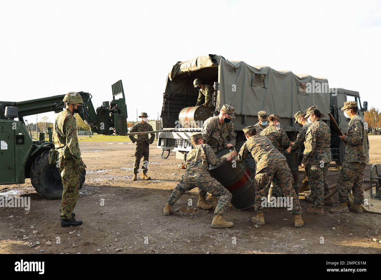 U.S. Marines with 12th Marine Regiment, 3d Marine Division, conduct a ...