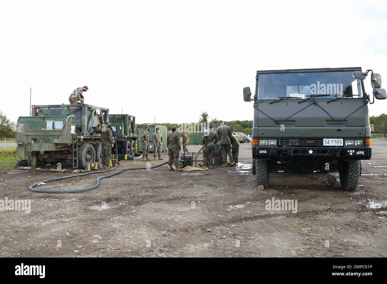 U.S. Marines with 12th Marine Regiment, 3d Marine Division, conduct a ...