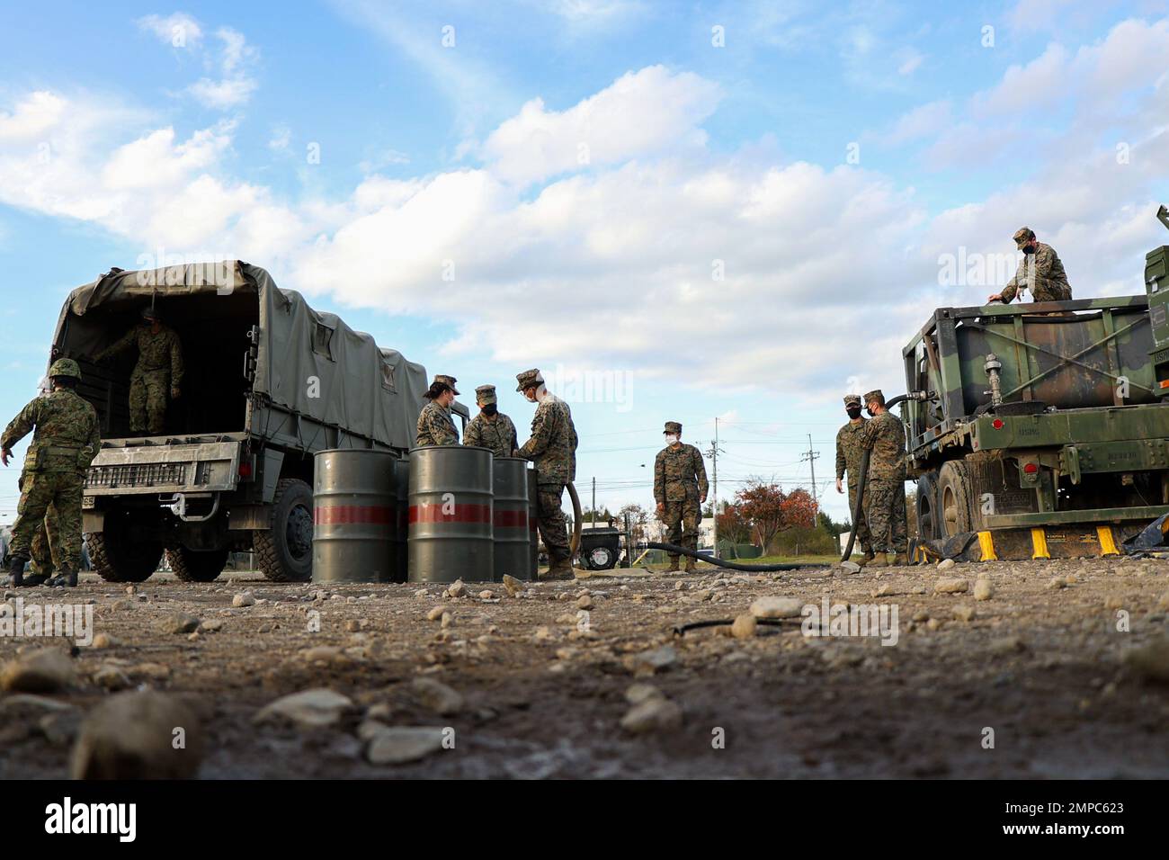 U.S. Marines with 12th Marine Regiment, 3d Marine Division, conduct a ...