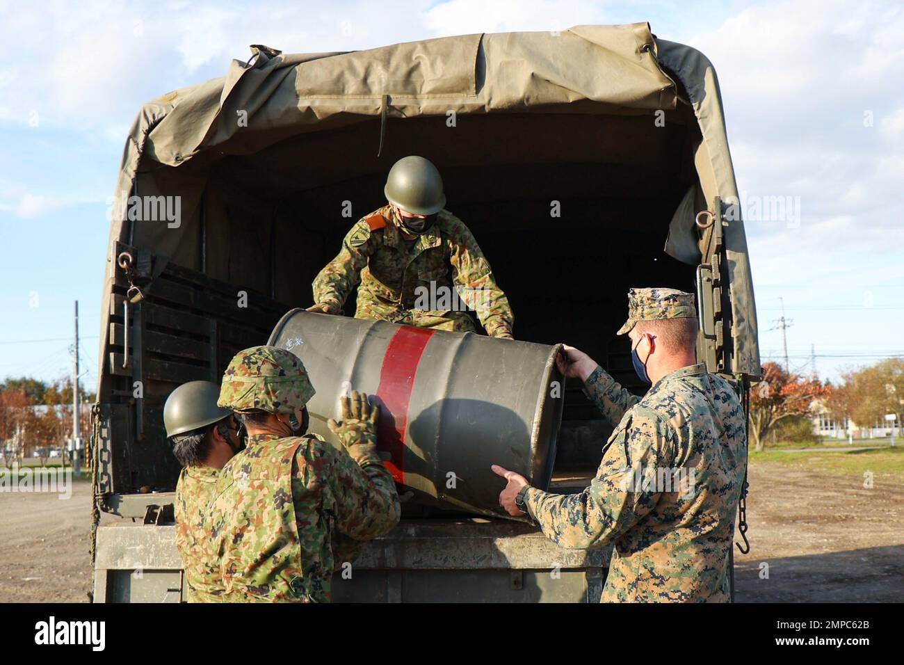 U.S. Marines with 12th Marine Regiment, 3d Marine Division, conduct a ...