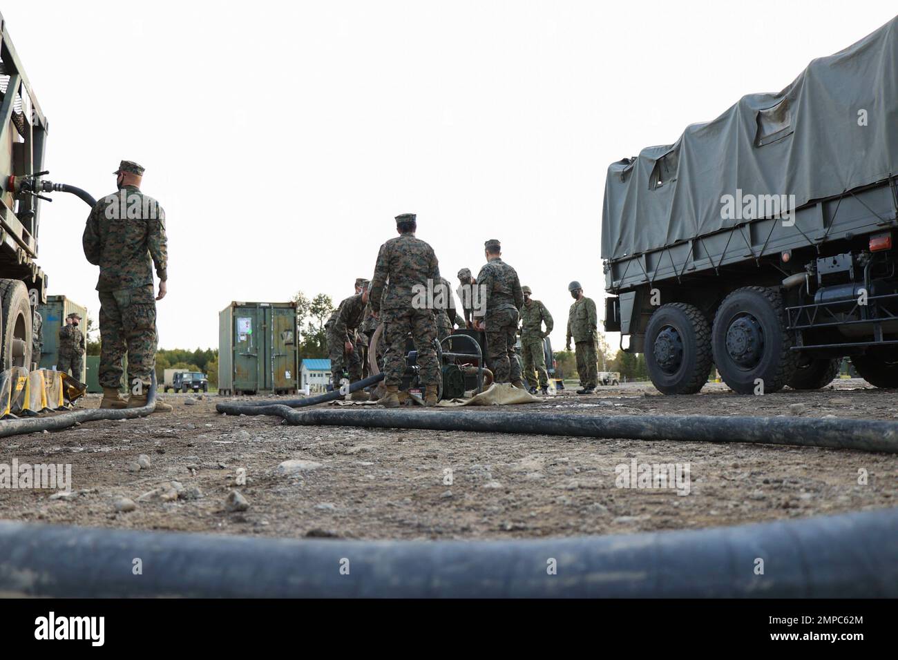 U.S. Marines with 12th Marine Regiment, 3d Marine Division, conduct a ...
