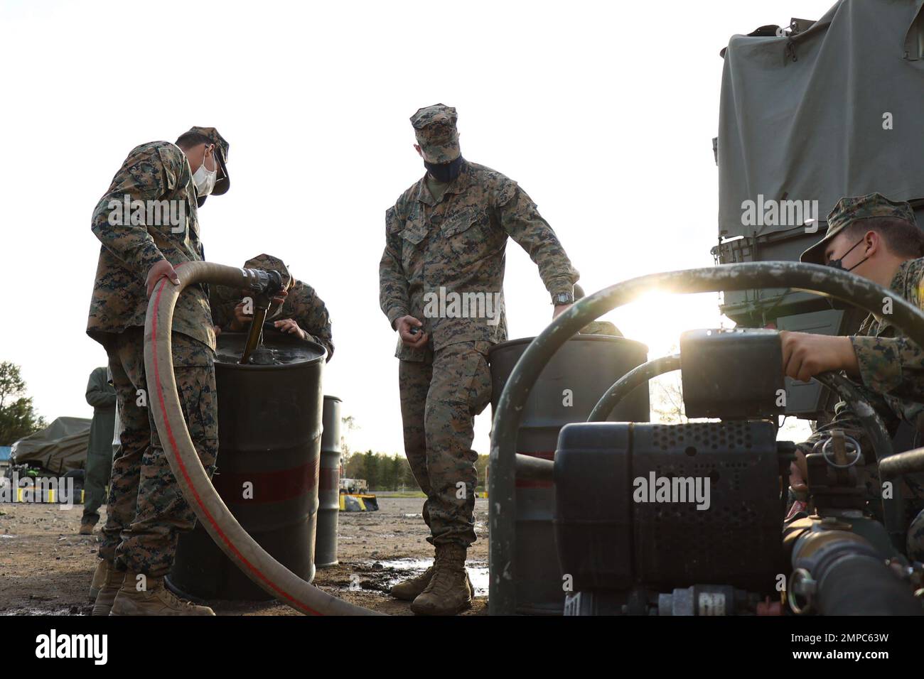 U.S. Marines with 12th Marine Regiment, 3d Marine Division, conduct a ...
