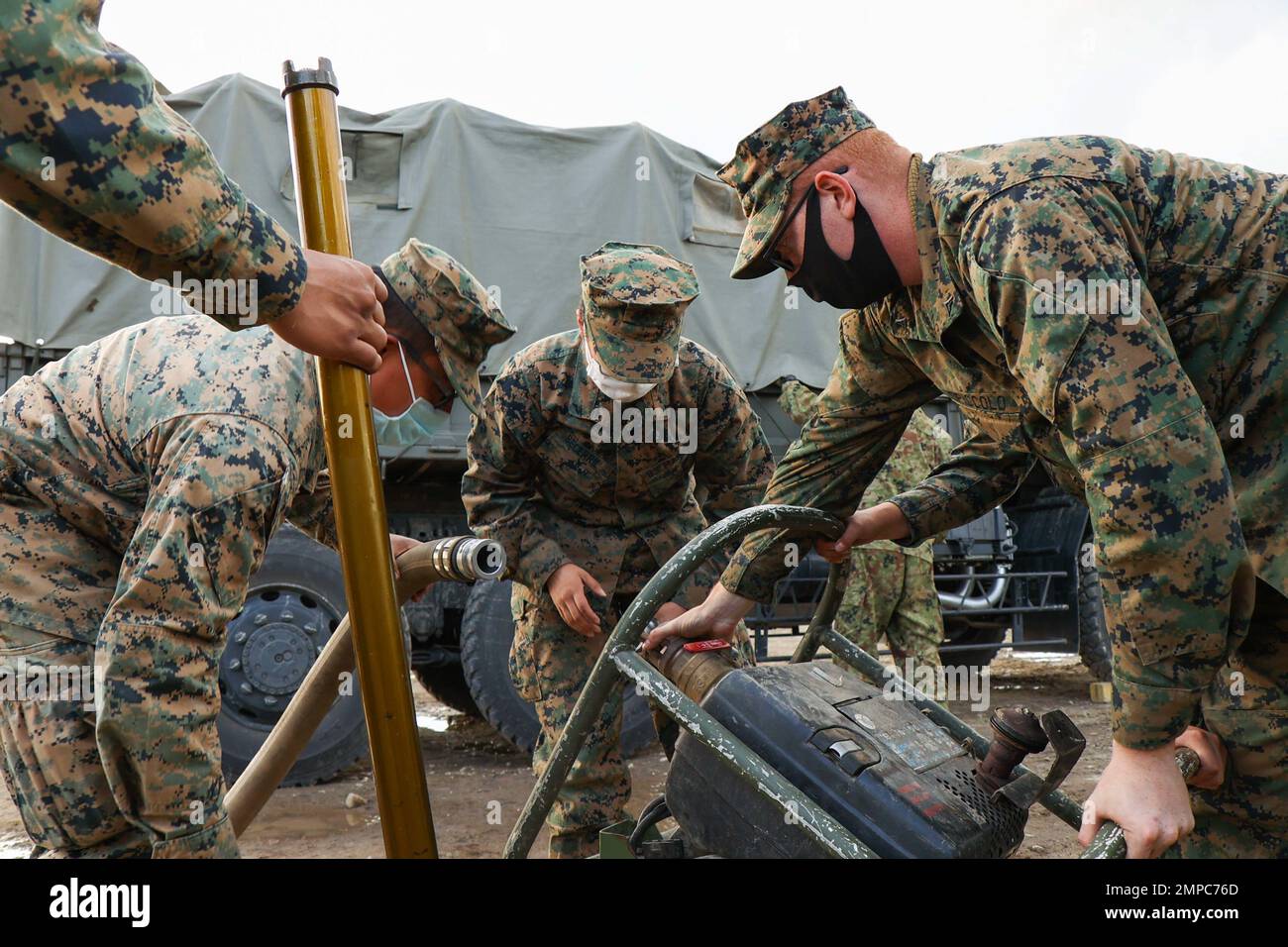 U.S. Marines with 12th Marine Regiment, 3d Marine Division, conduct a ...