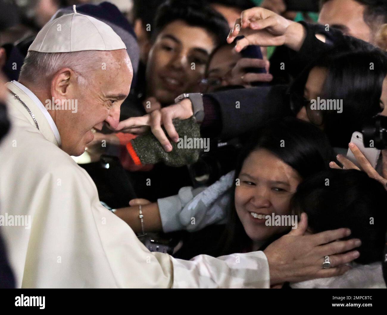 Pope Francis stops to greet the faithful after praying in front of the ...