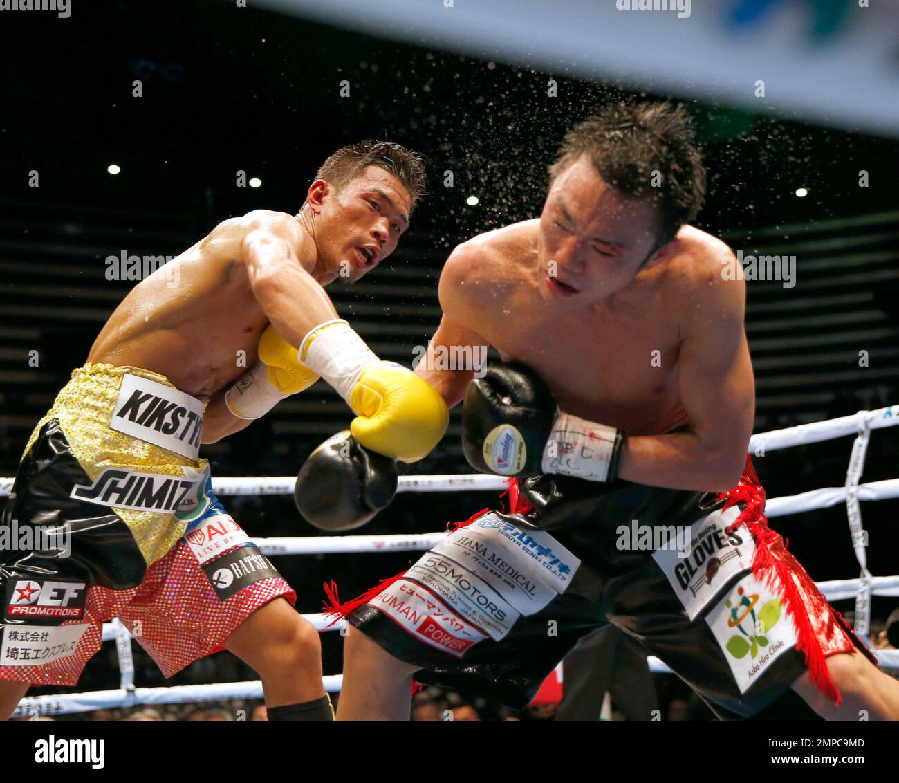 Japanese champion Sho Kimura, left, sends a right to his compatriot ...