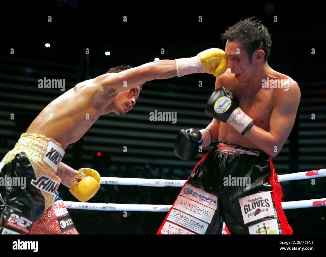 Japanese champion Sho Kimura, left, sends a right to his compatriot ...