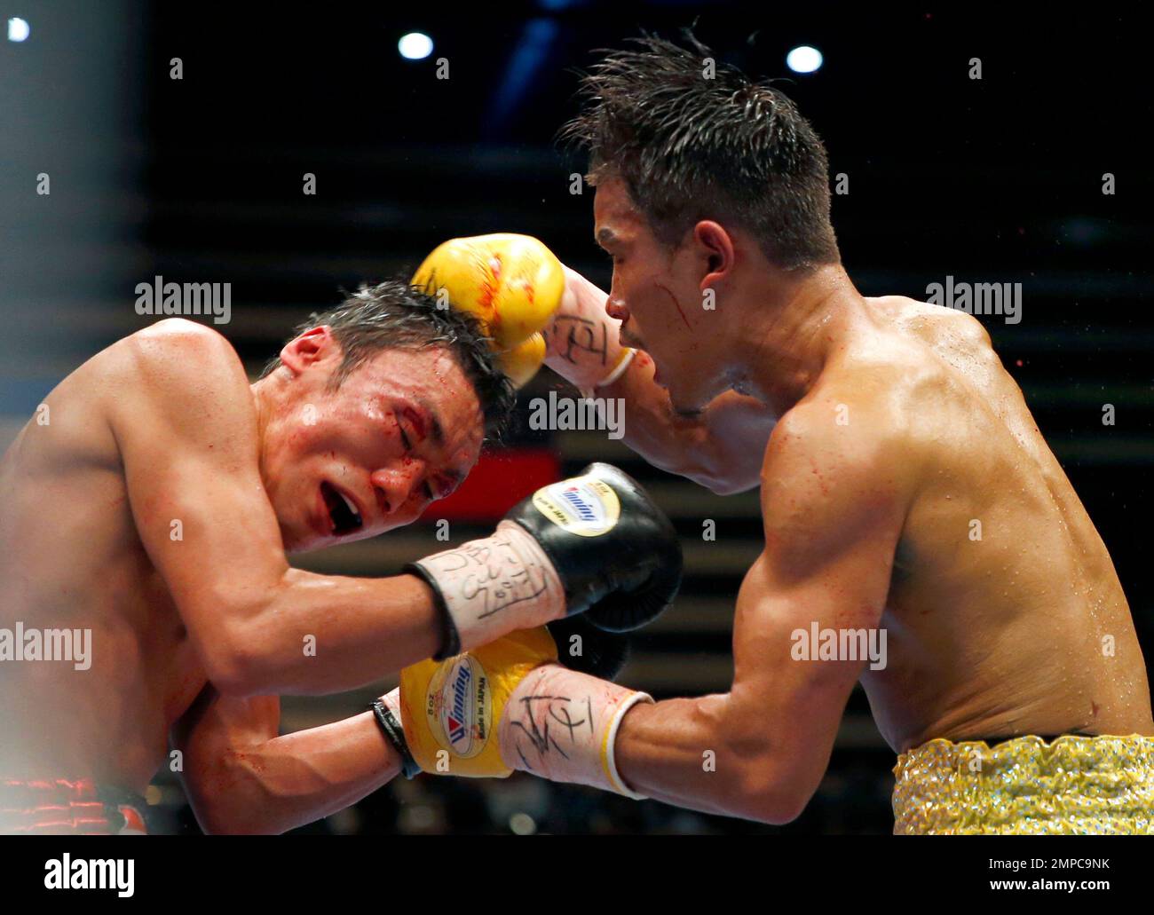 Japanese champion Sho Kimura, right, fights with his compatriot ...
