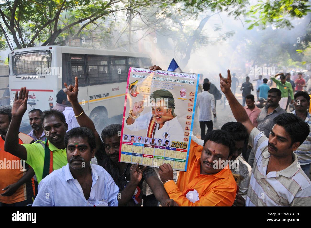 Indian movie superstar Rajinikanth fans burn firecrackers and hold his ...