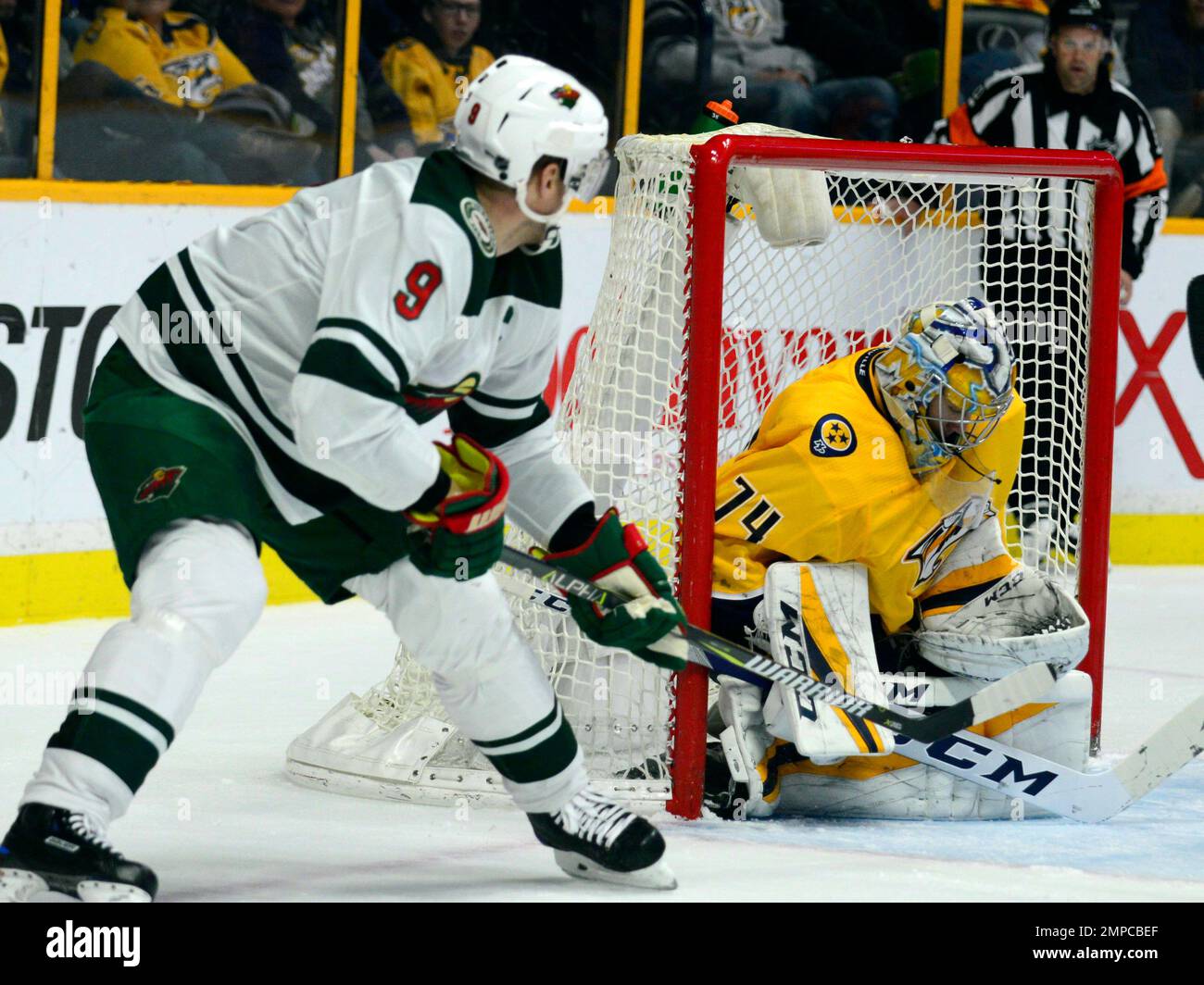 Nashville Predators goalie Juuse Saros (74) stops a shot by Minnesota ...