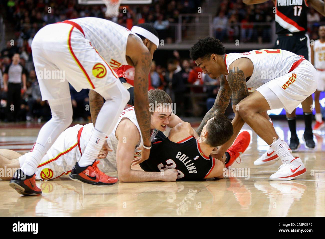 Atlanta Hawks guard Malcolm Delaney, left, forward Tyler Cavanaugh ...