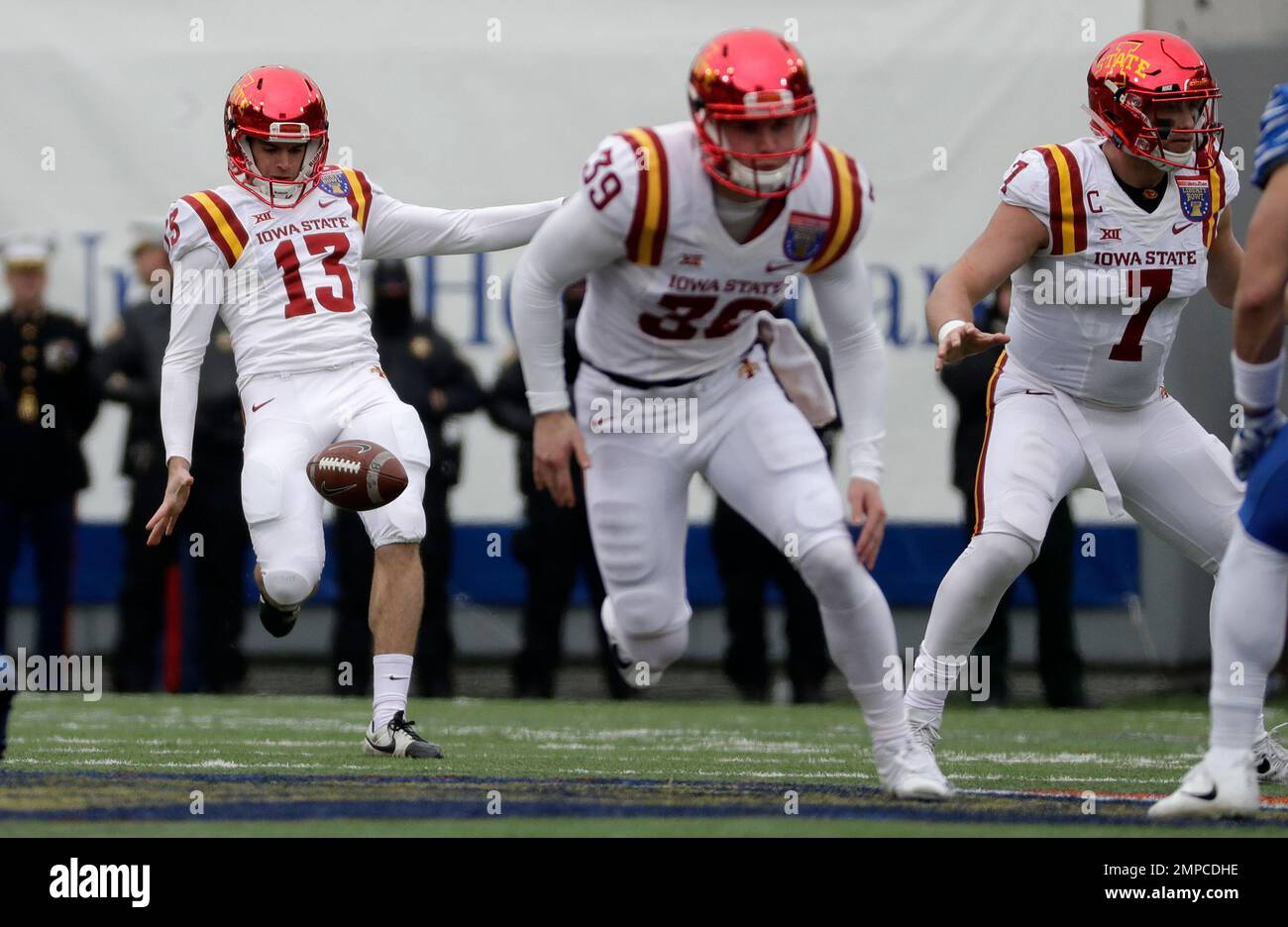 Iowa State punter Colin Downing (13) kicks against Memphis in the first ...
