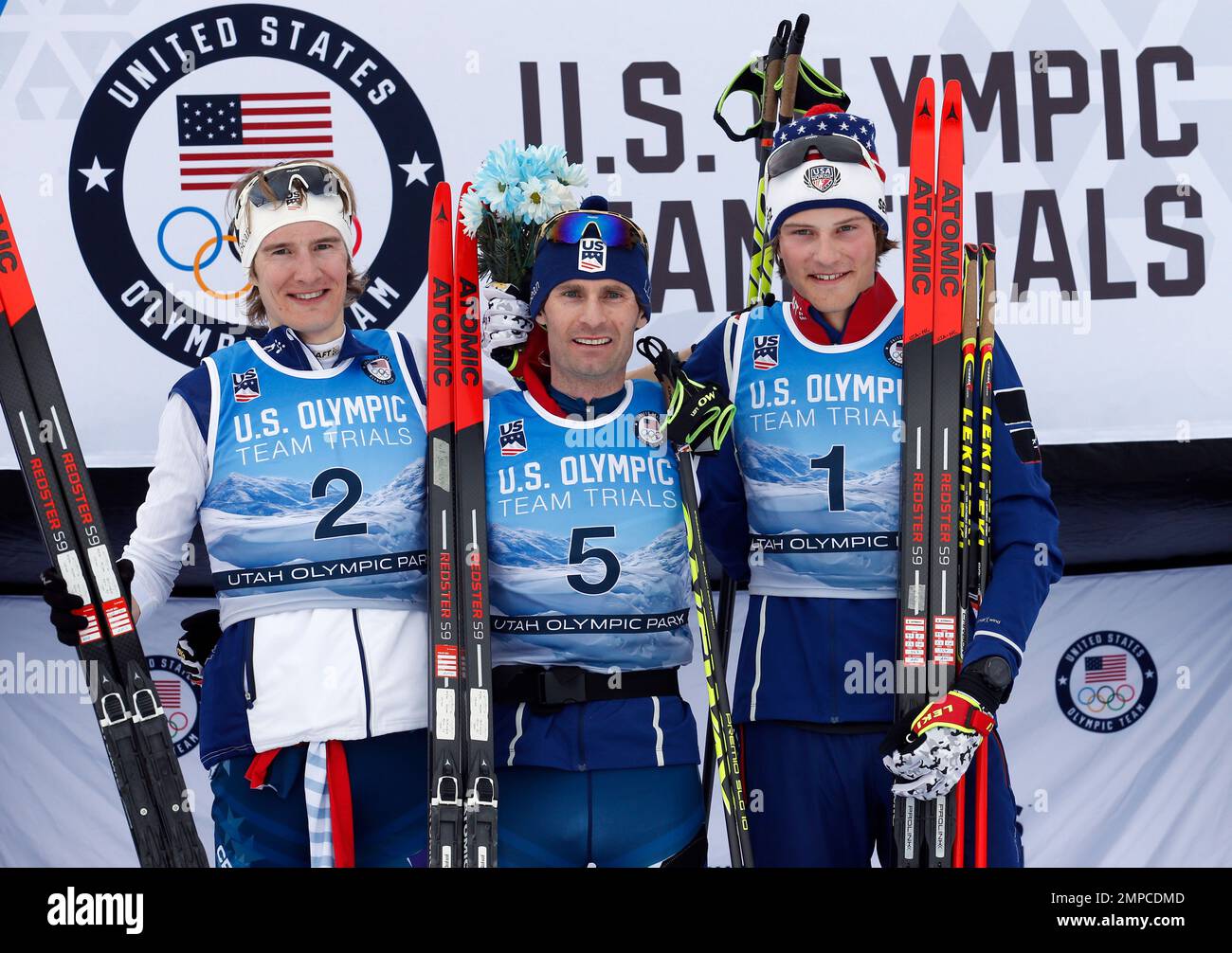First place finisher Bryan Fletcher (5) shares the podium with second ...