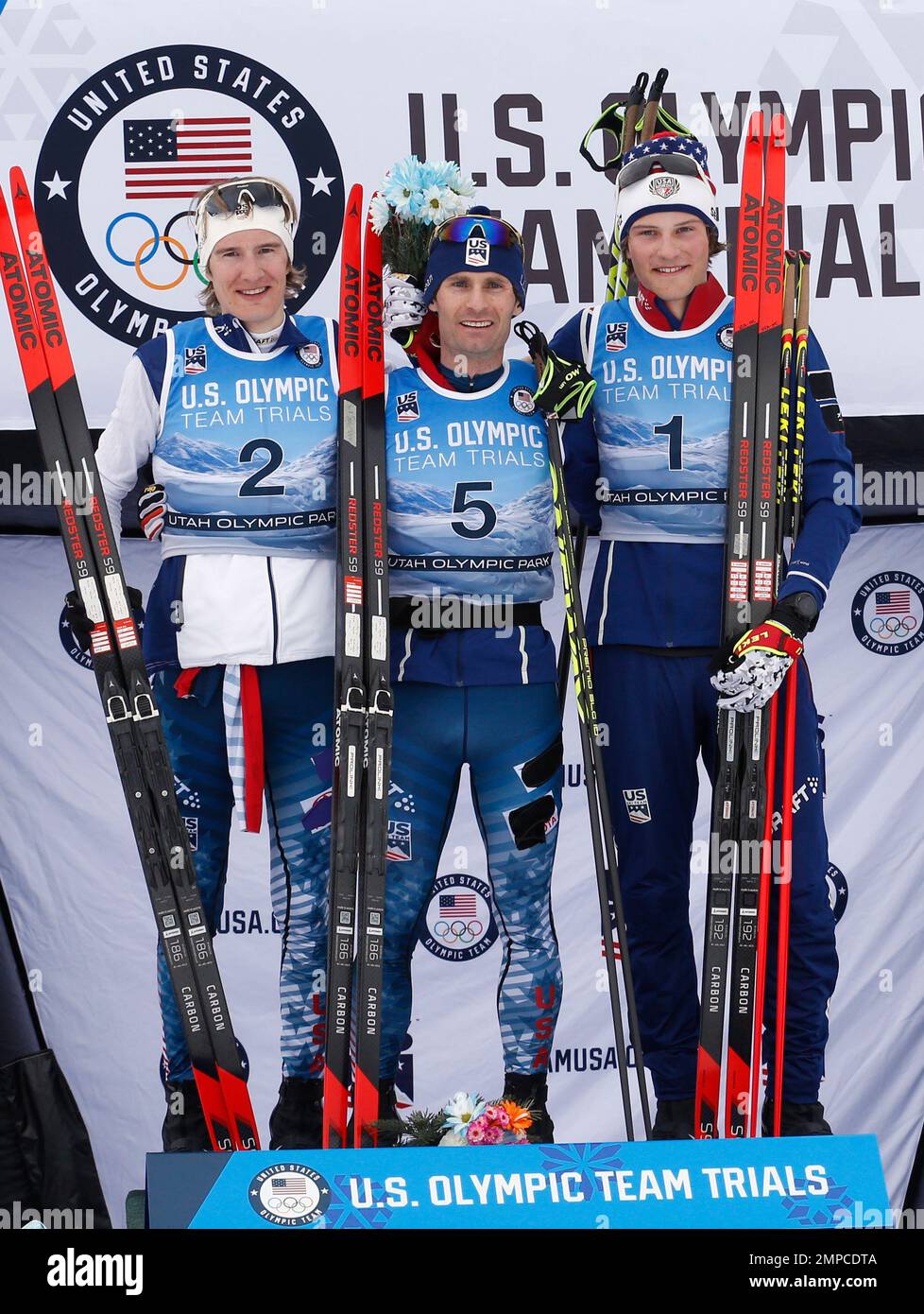 First place finisher Bryan Fletcher (5) shares the podium with second ...