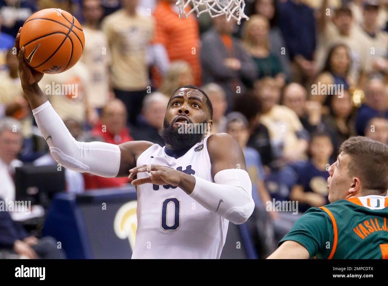 Pittsburgh's Jared Wilson-Frame (0) shoots as he he gets past Miami's ...