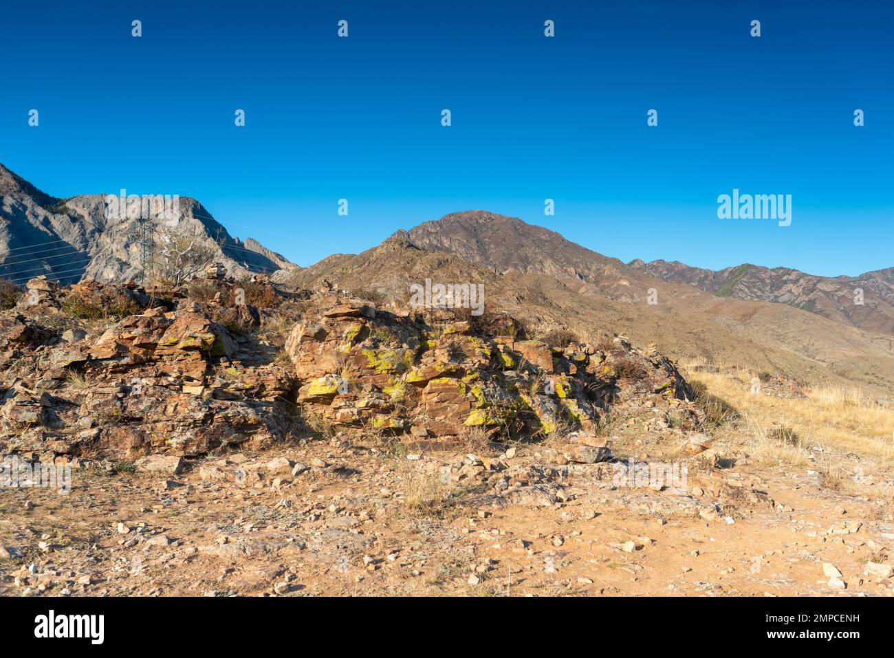 Power transmission lines with pylons stand against the backdrop of the ...