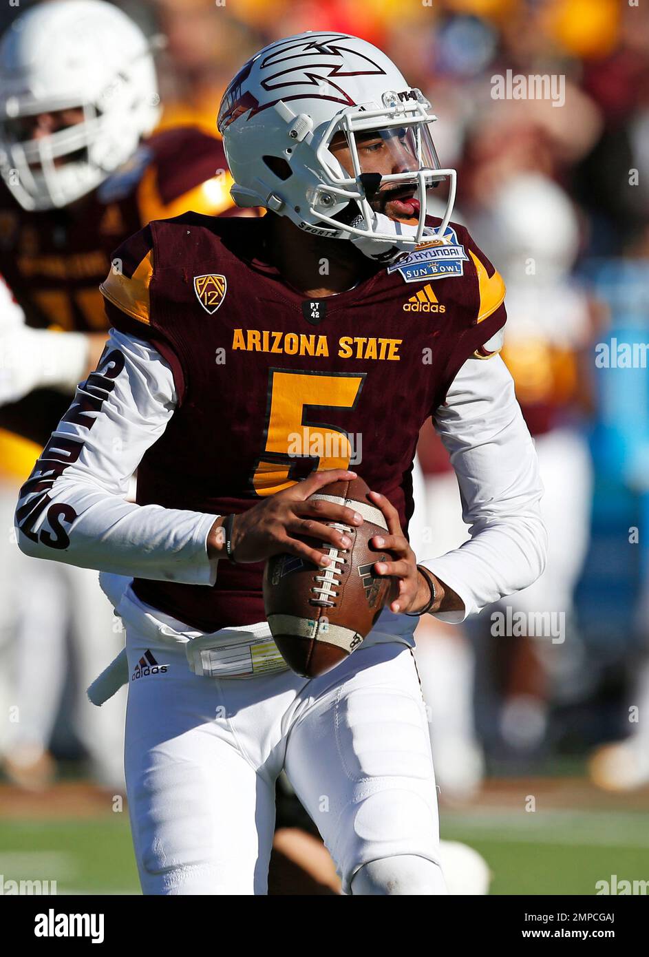 Arizona State quarterback Manny Wilkins searches for a receiver during ...